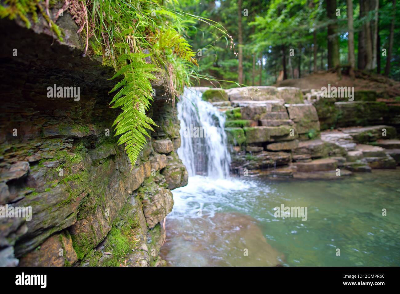 Amazing landscape of beautiful waterfall on mountain river with white ...