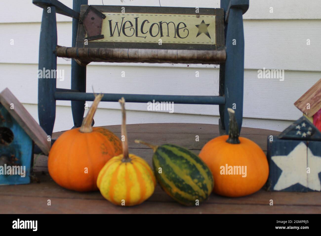 Pumpkins and gourds with welcome sign Stock Photo - Alamy