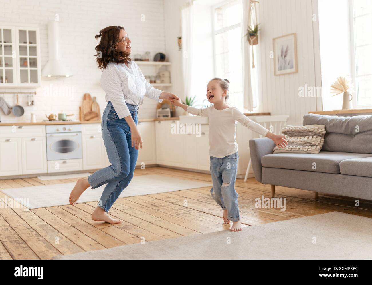 Mom and her daughter child girl are dancing. Family holiday and ...