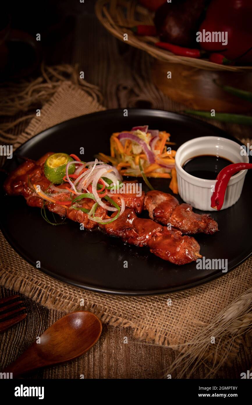 Vertical shot of pork barbeque with sauce Stock Photo - Alamy