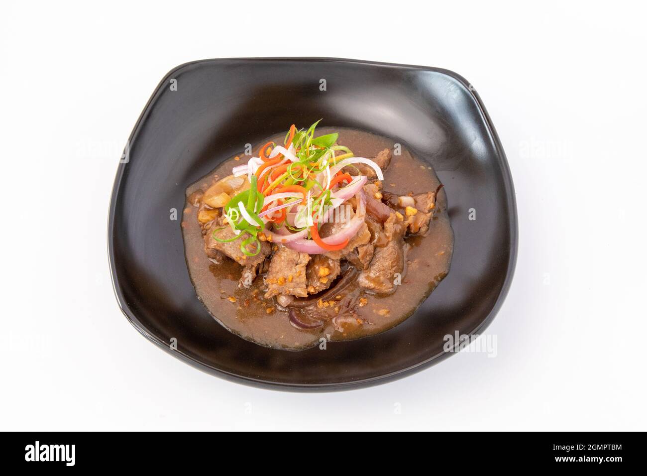 Top view shot of bistek tagalog on a white background Stock Photo - Alamy