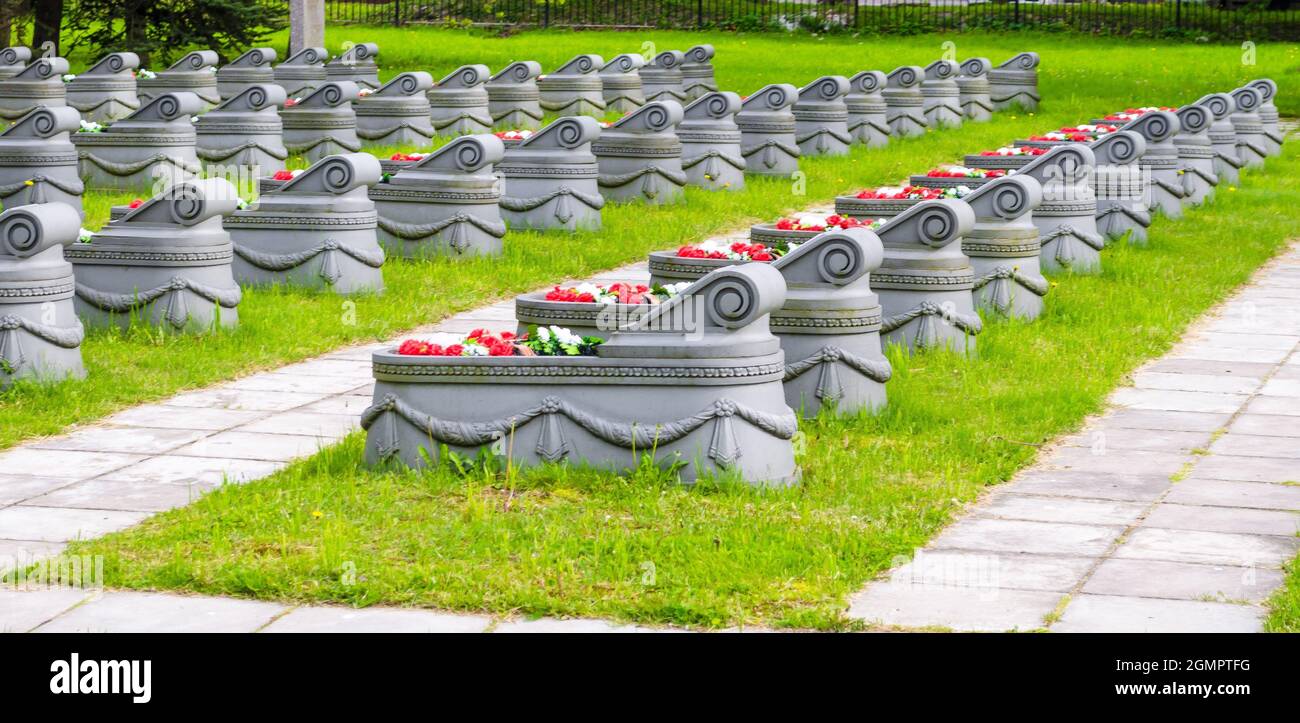 Graves in the cemetery grass and paths around them Stock Photo - Alamy