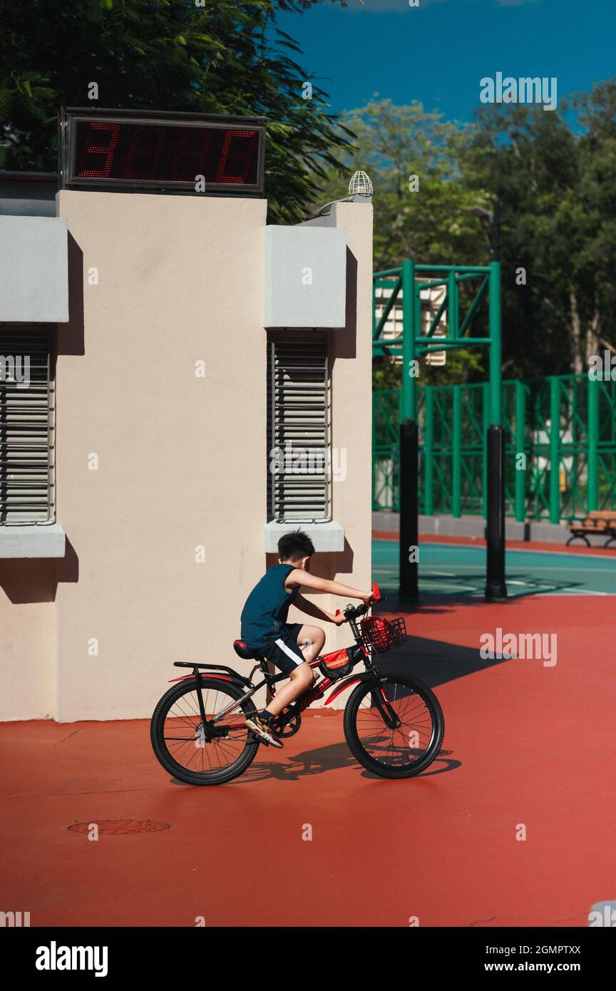 Kid riding a bicycle in the park Stock Photo - Alamy