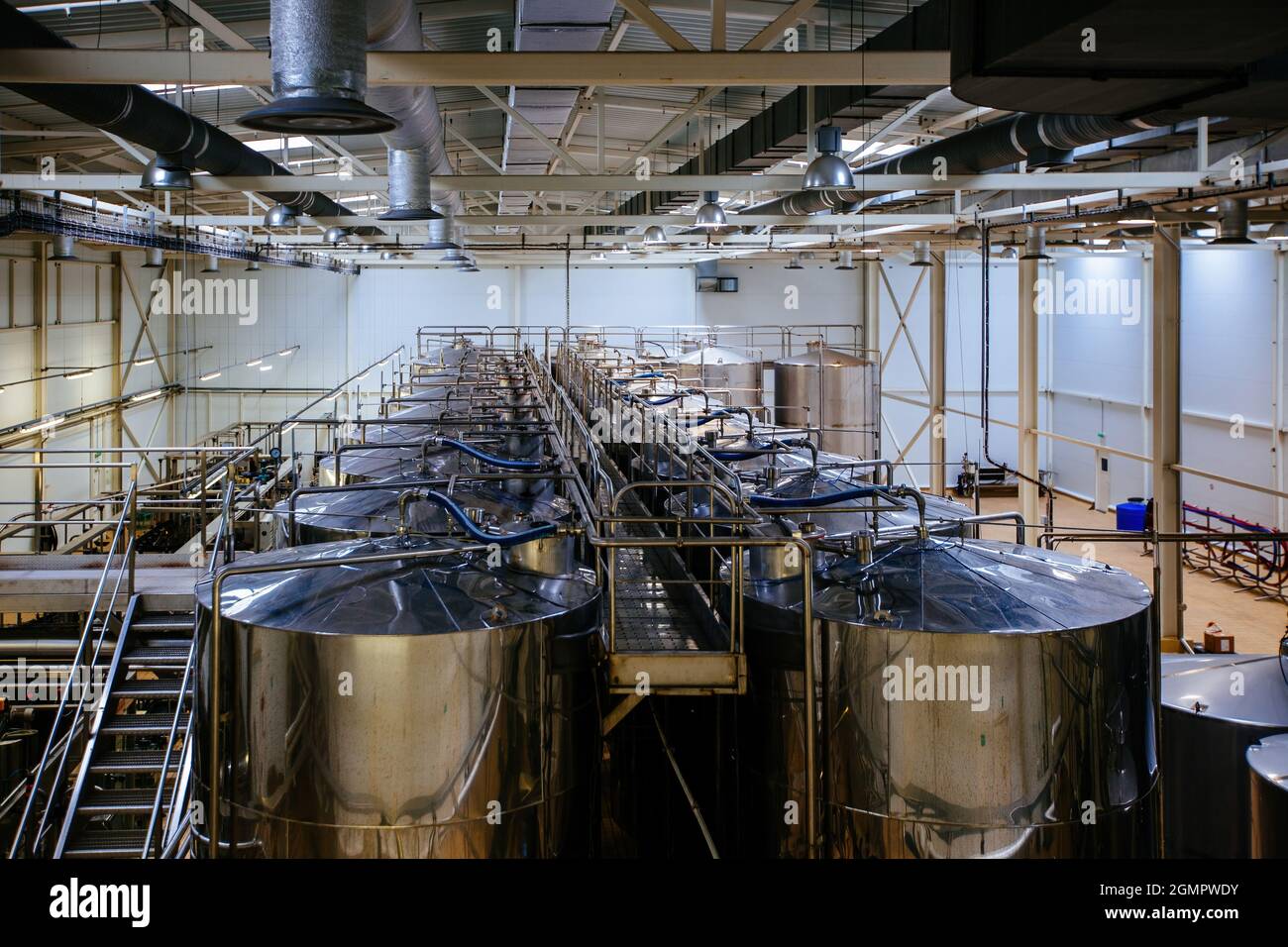 Modern winery production line. Storage vats and bottling equipment ...