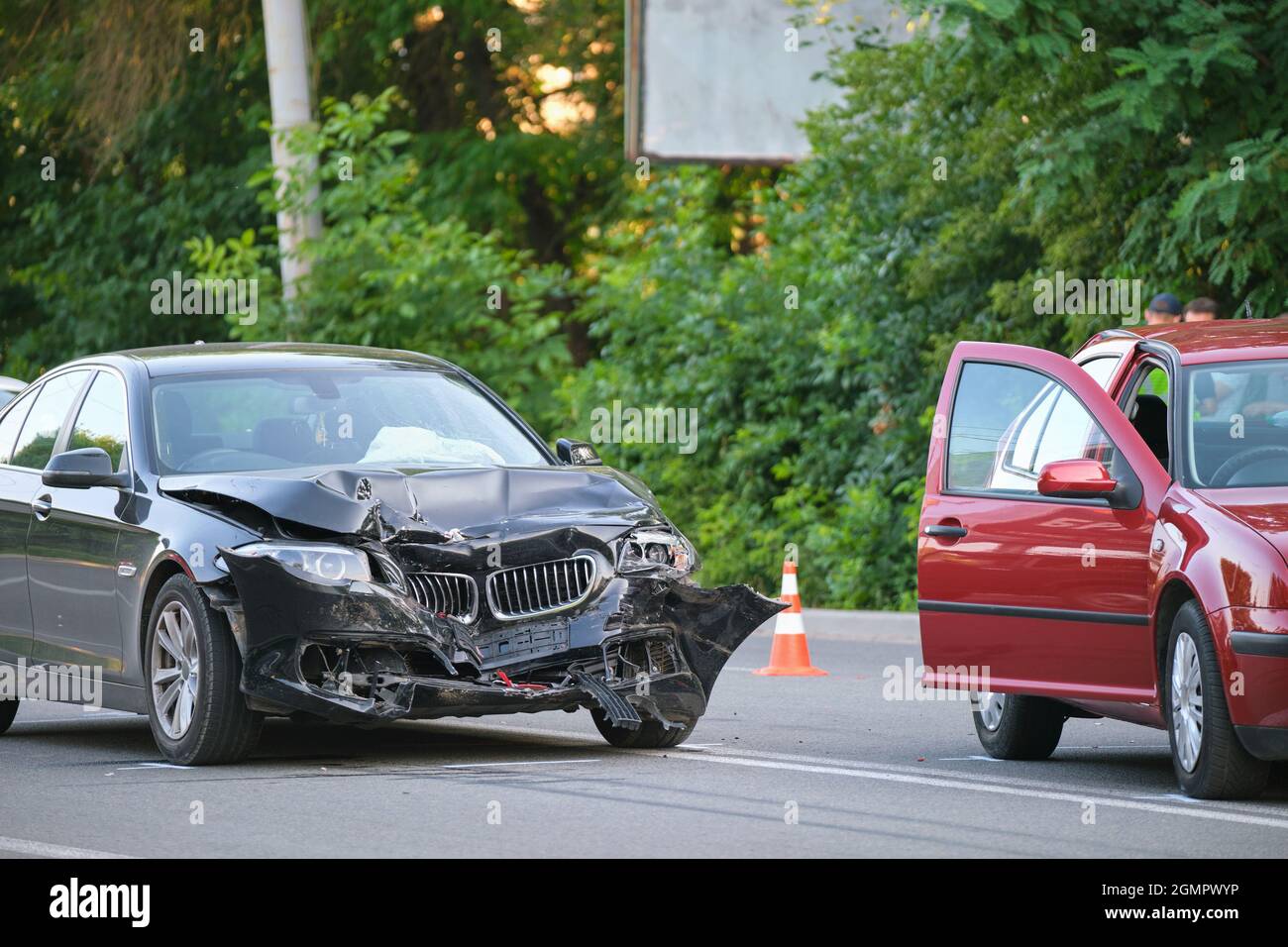 Damaged in heavy car accident vehicles after collision on city street ...