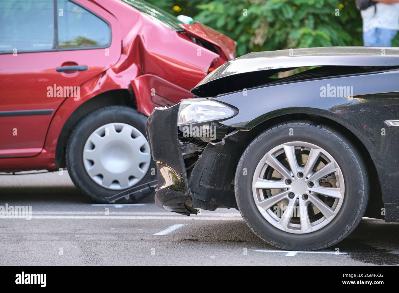 Damaged in heavy car accident vehicles after collision on city street ...