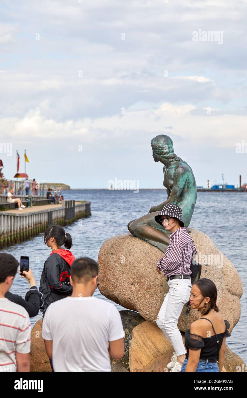 Tourists by the Little Mermaid (bronze statue by Edvard Eriksen, 1913); Copenhagen, Denmark ...