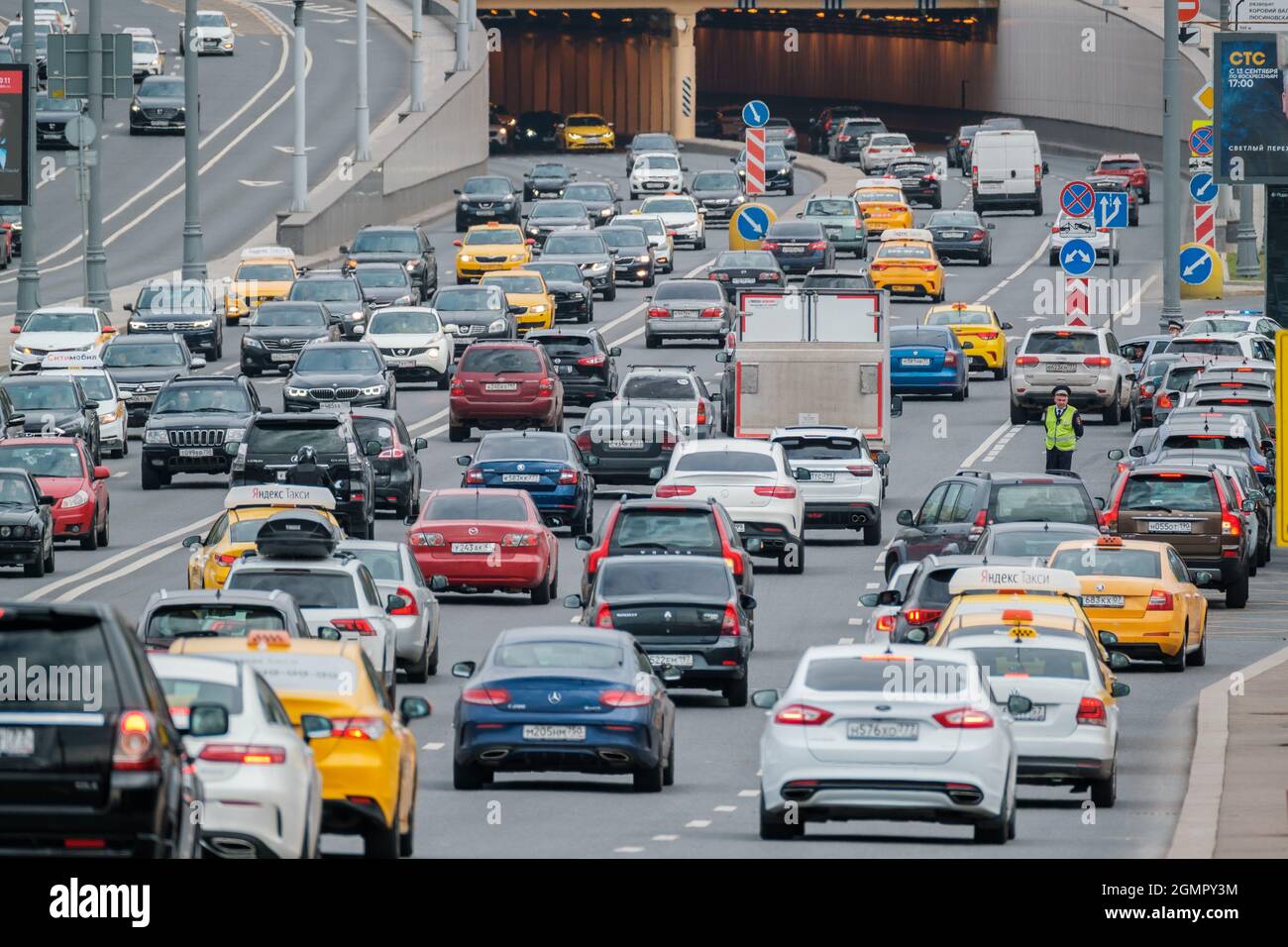 Traffic on a multi-lane road in big city center downtown, day time ...