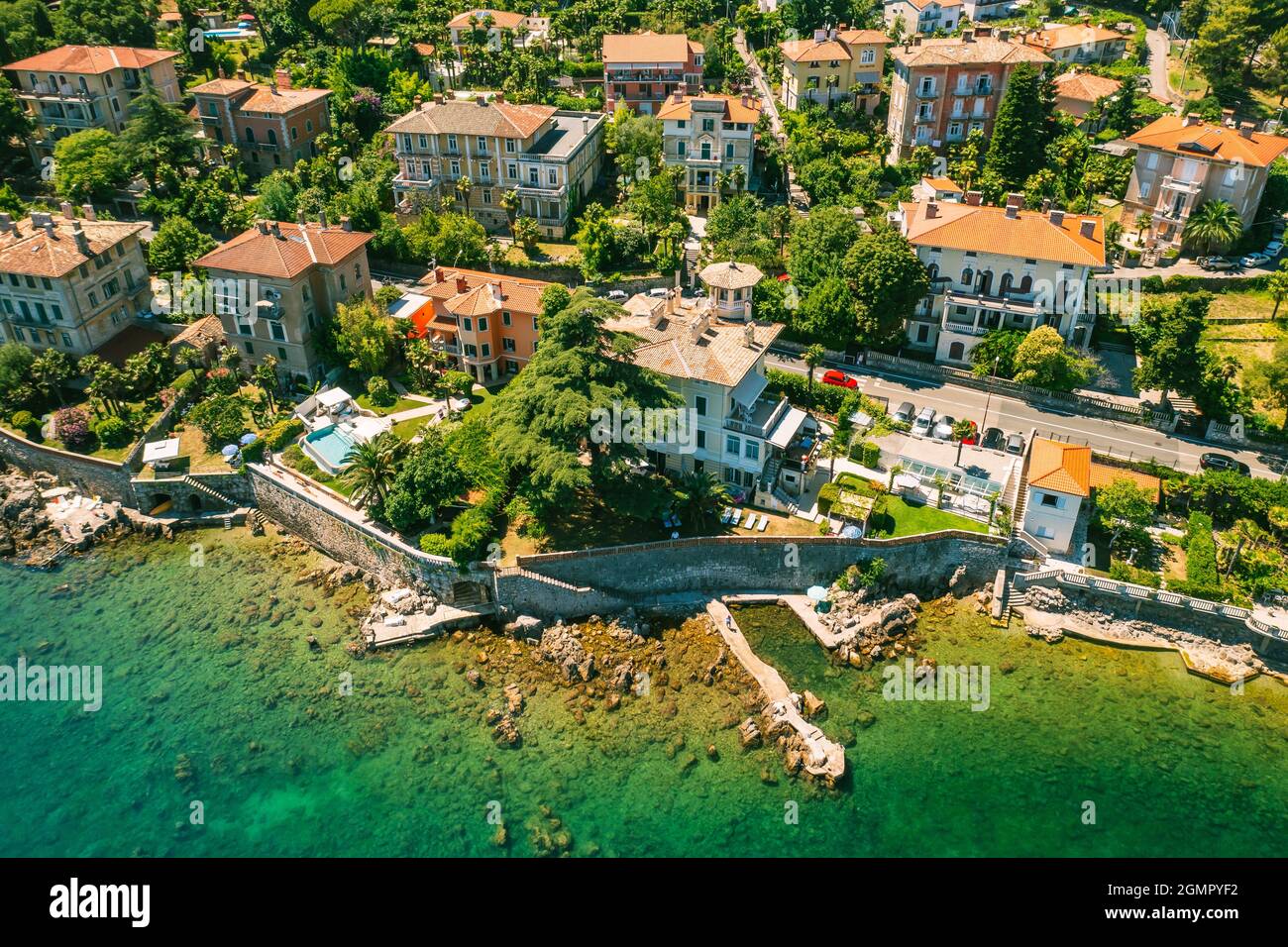 Beautiful villas near the coast of rocky beach in a small town Lovran ...