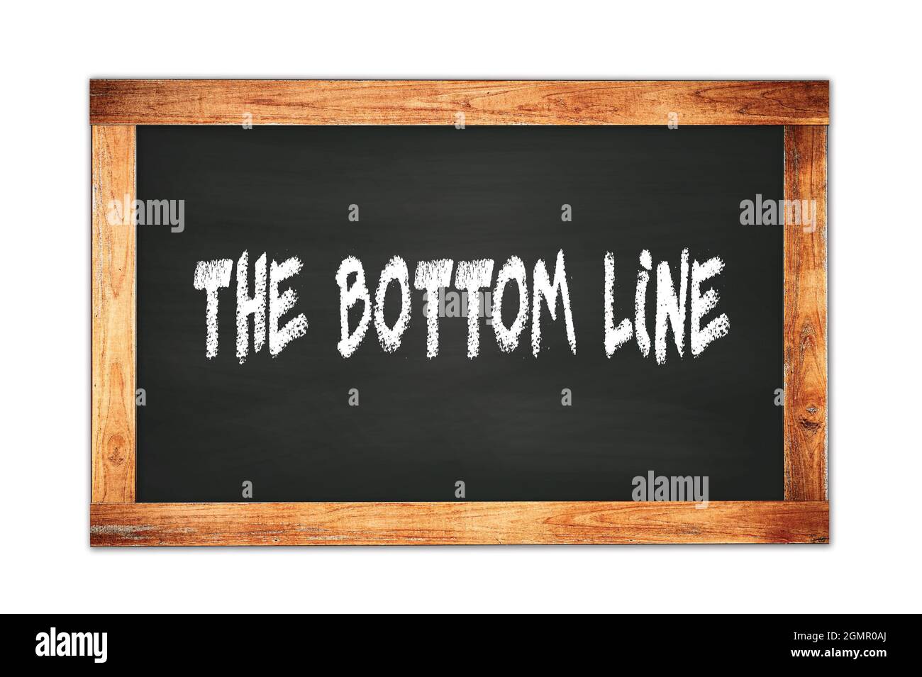 THE BOTTOM LINE text written on black wooden frame school blackboard ...