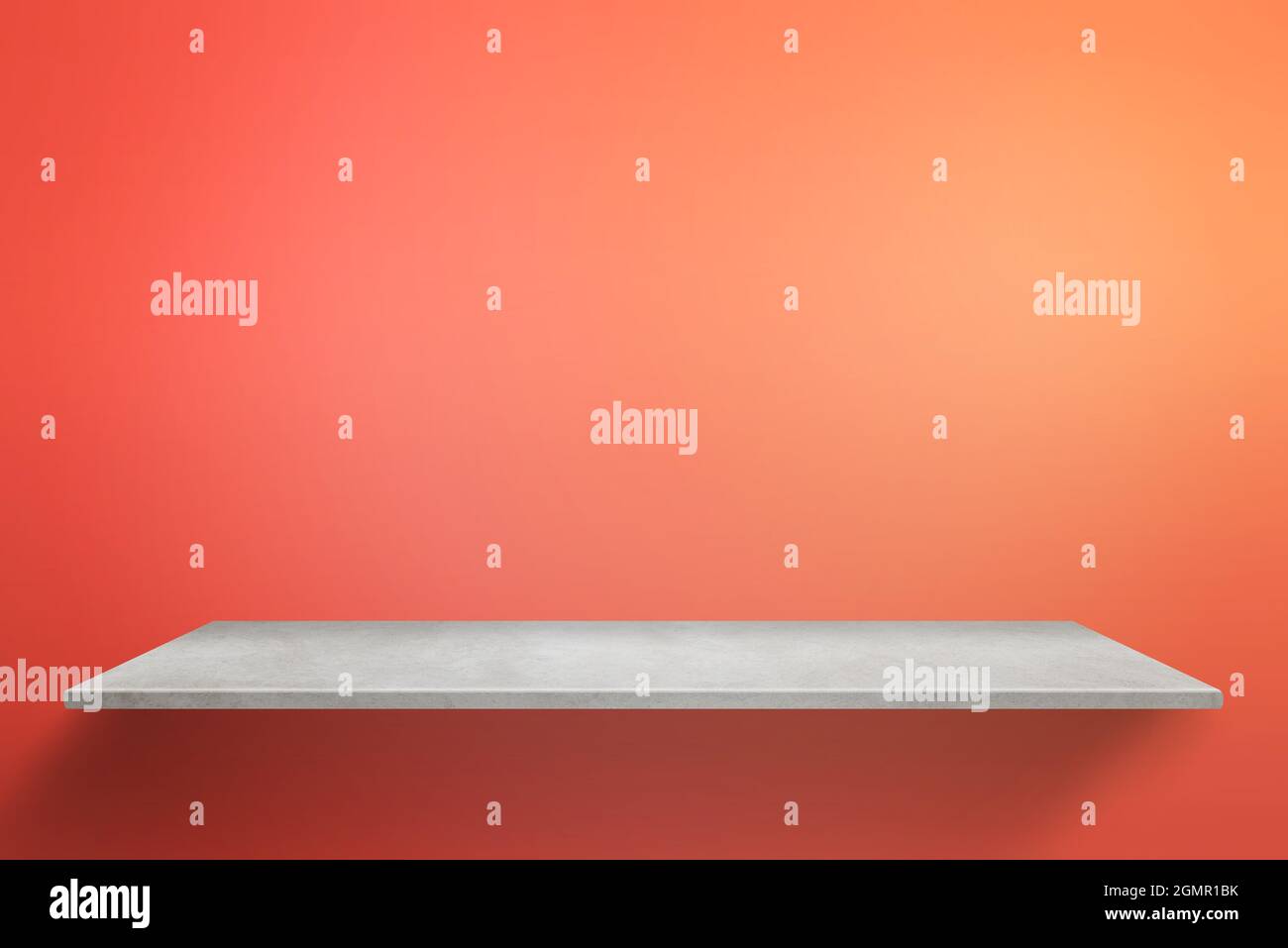 Empty table with red wall in background Stock Photo - Alamy