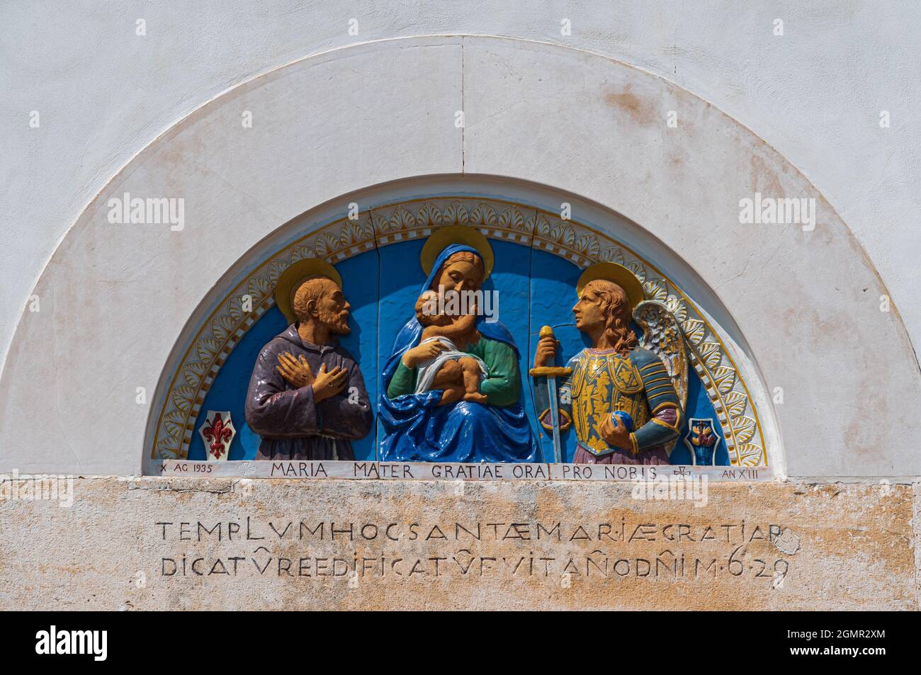 The church has a rectangular plan with a simple façade, decorated by a ...