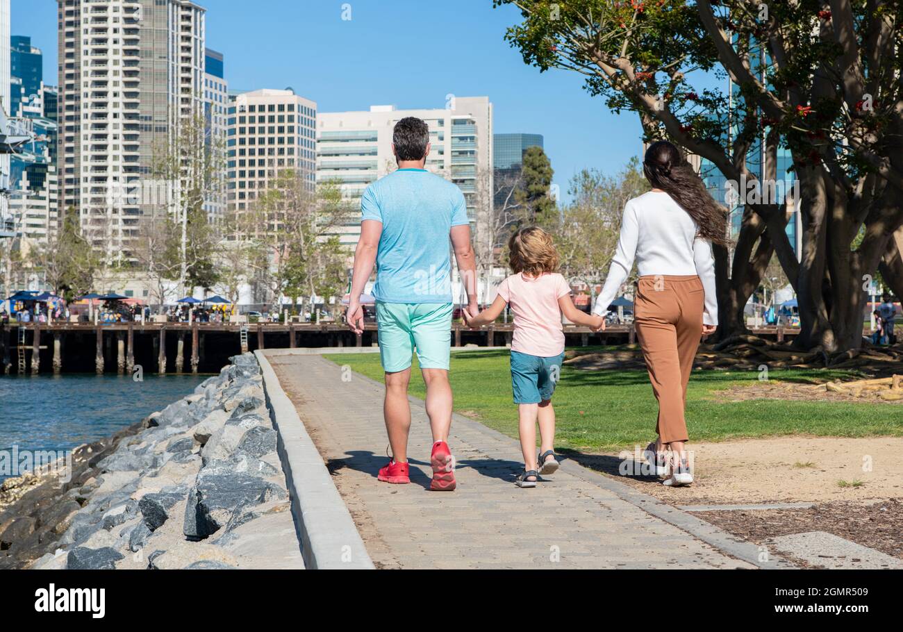Child parents back view walking hi-res stock photography and images - Alamy