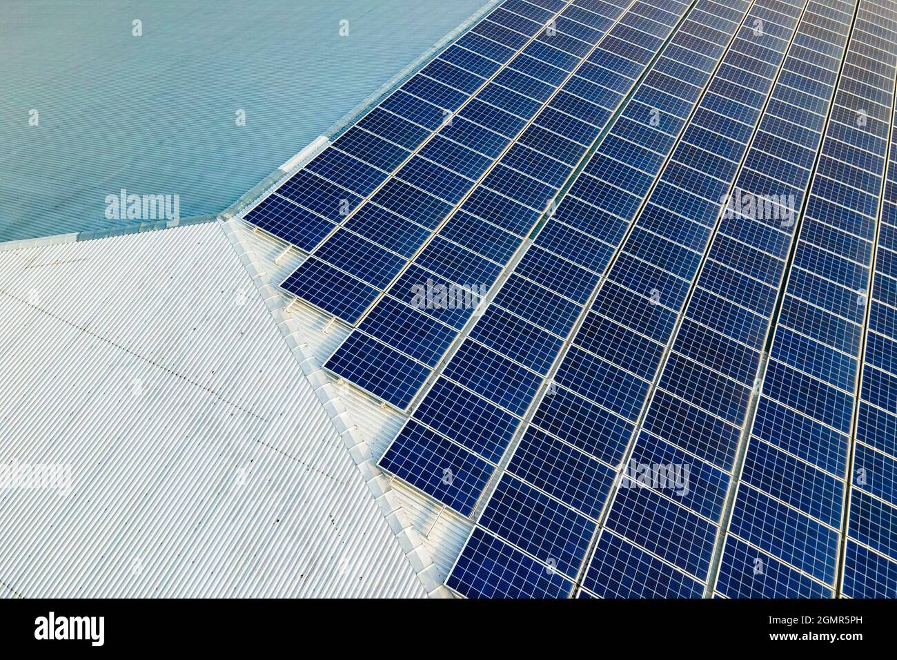 Aerial view of surface of blue photovoltaic solar panels mounted on ...