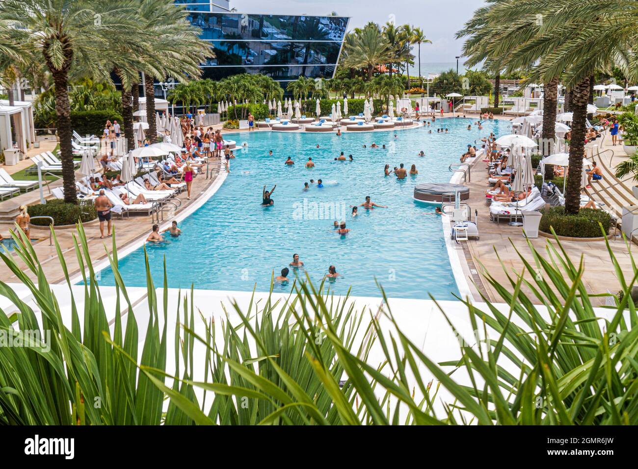 Fontainebleau miami beach hotel swimming pool area guests hi-res stock ...