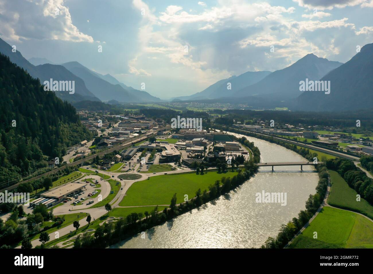 Landscape of a river surrounded by hills and greenery in Rattenberg ...