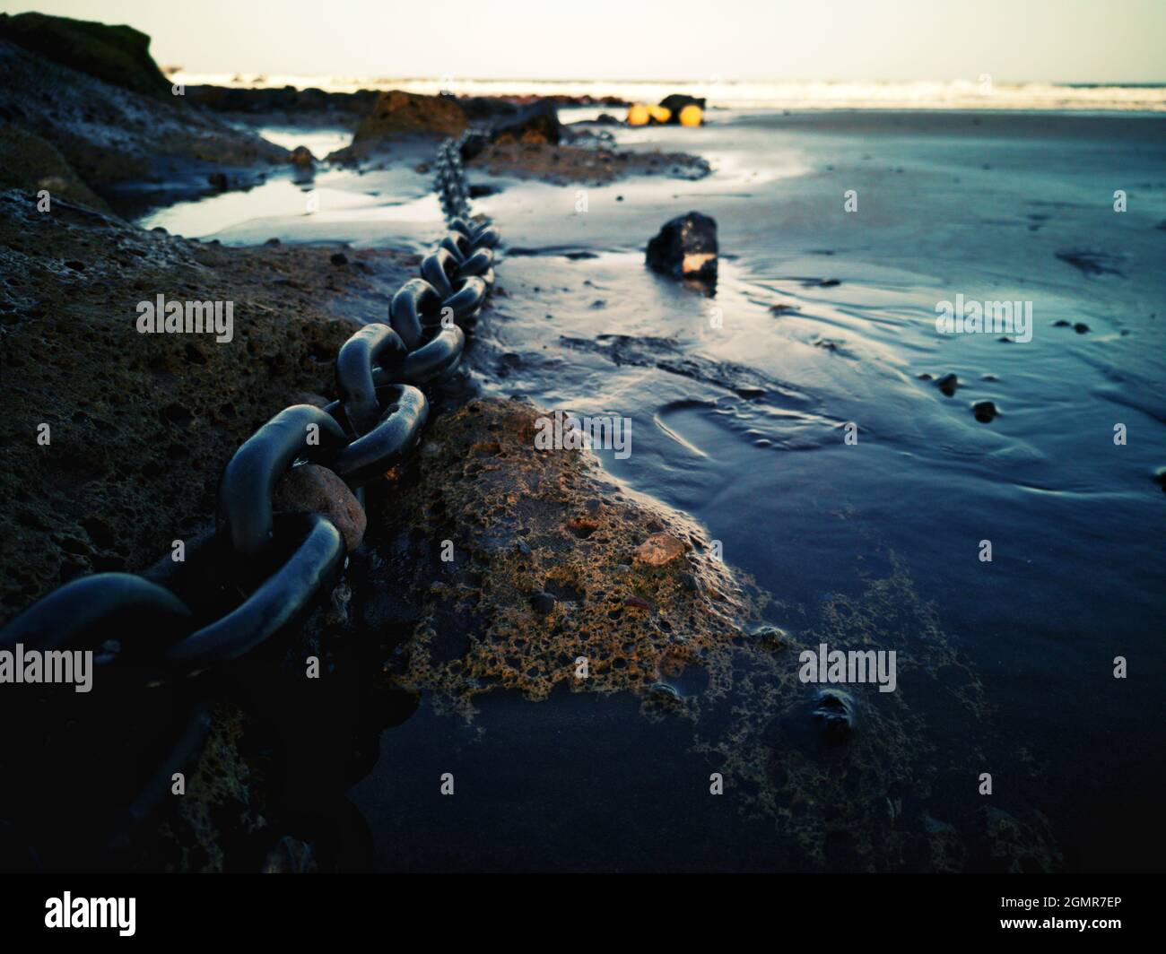 Scenic view of a long chain on the beach Stock Photo - Alamy