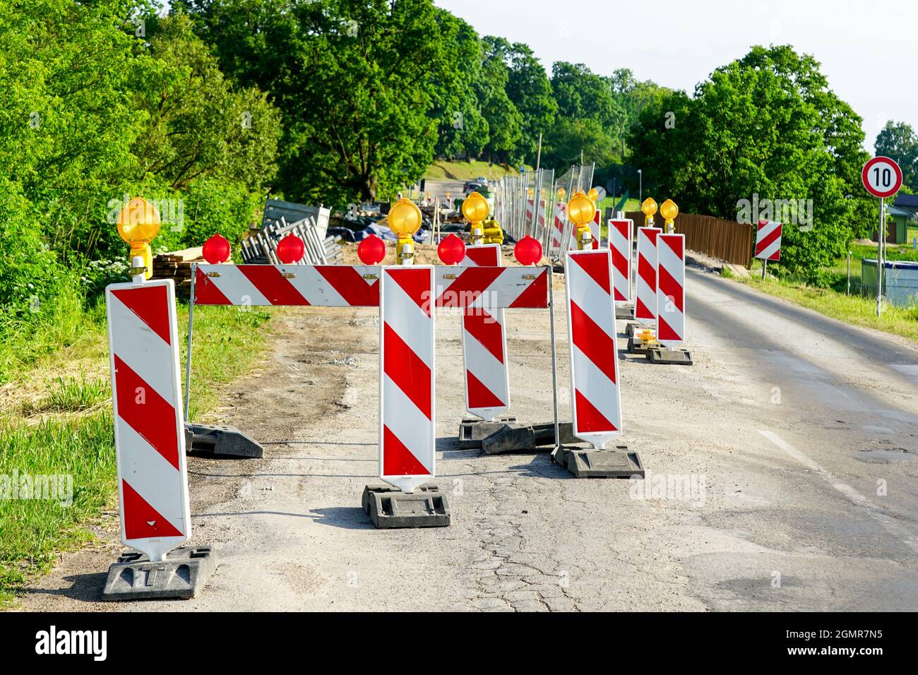 traffic restrictions with many warning signs during road bridge repairs ...