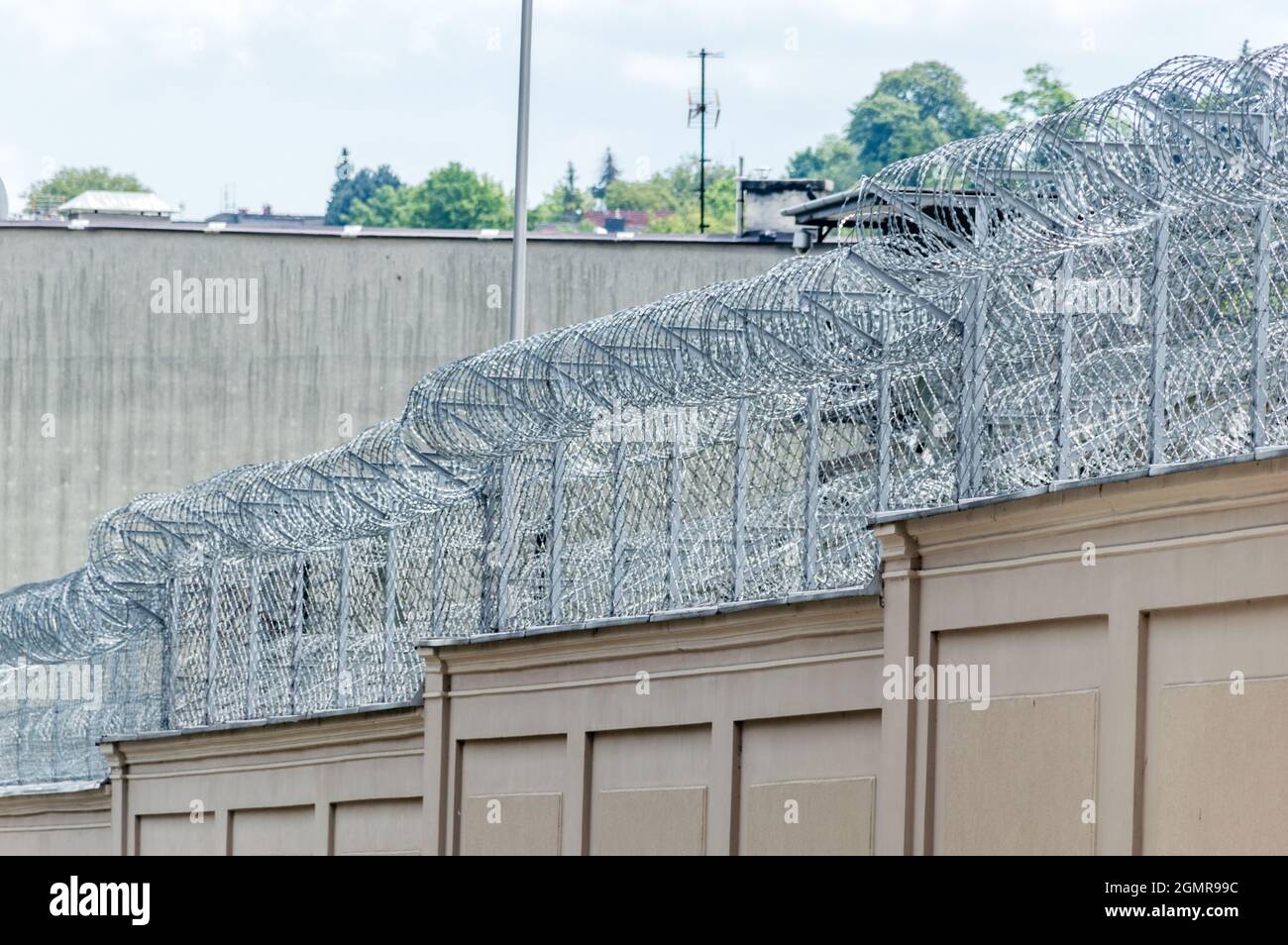 Barbed wire fence used for protection purposes of prison Stock Photo ...