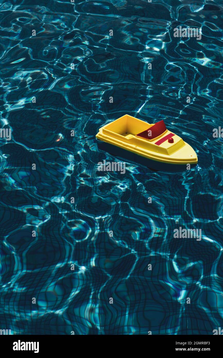 Yellow toy boat hi-res stock photography and images - Alamy