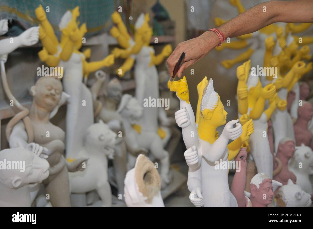 Non Exclusive: Artist Gourango Paul paints a sculpture of Goddess Durga ...