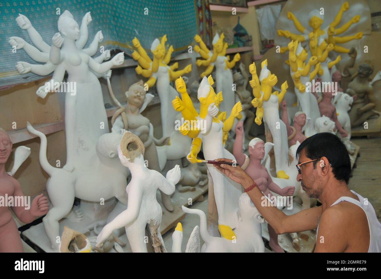 Non Exclusive: Artist Gourango Paul paints a sculpture of Goddess Durga ...