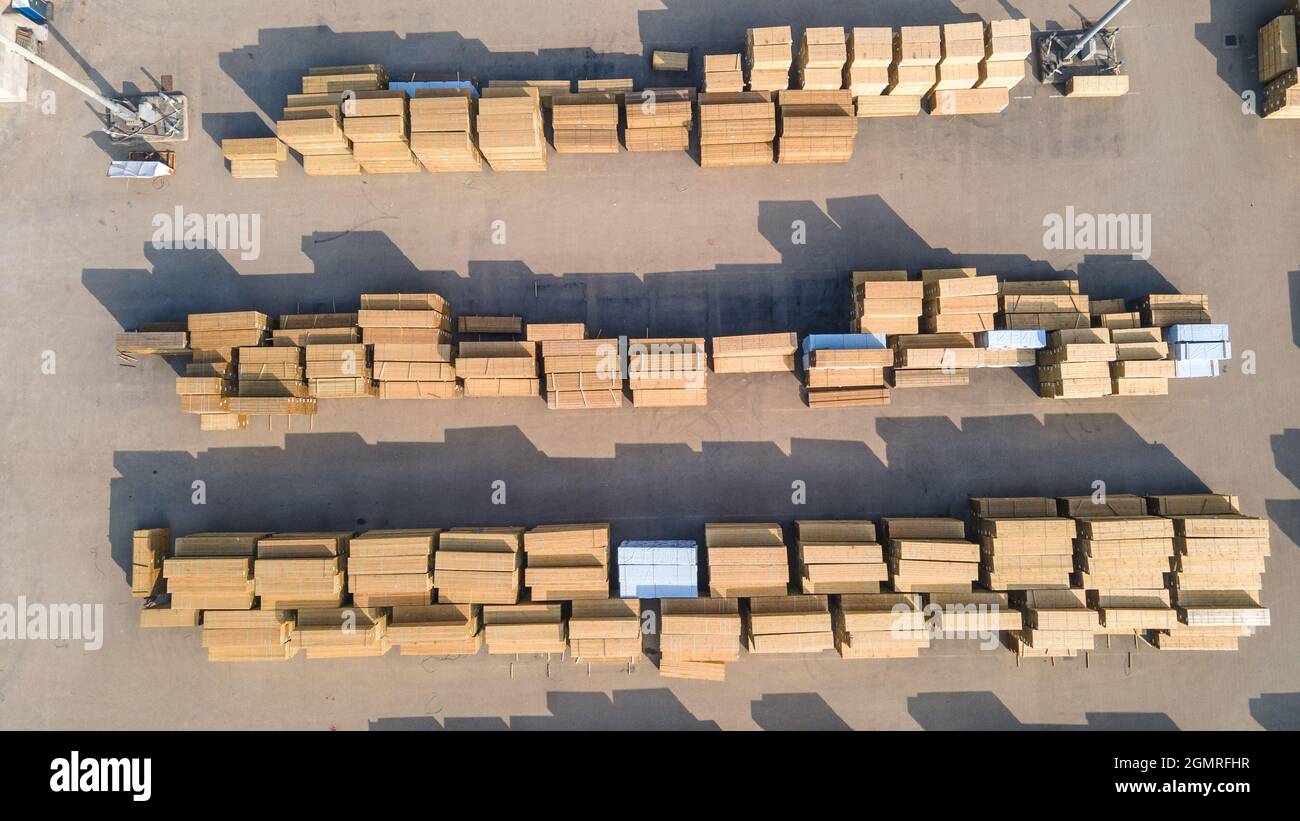 Aerial view of storage facility with building materials in industrial ...