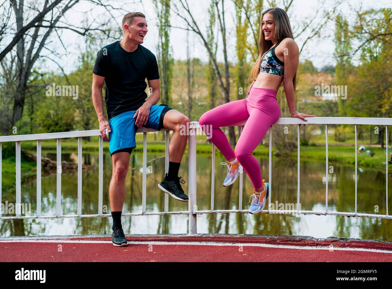 Sweaty athletes taking a rest after road running race or marathon ...