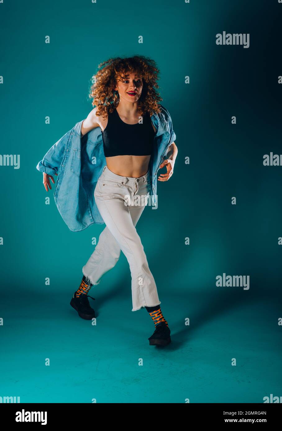 Artistic modern dancer practicing dancing moves in the studio Stock ...