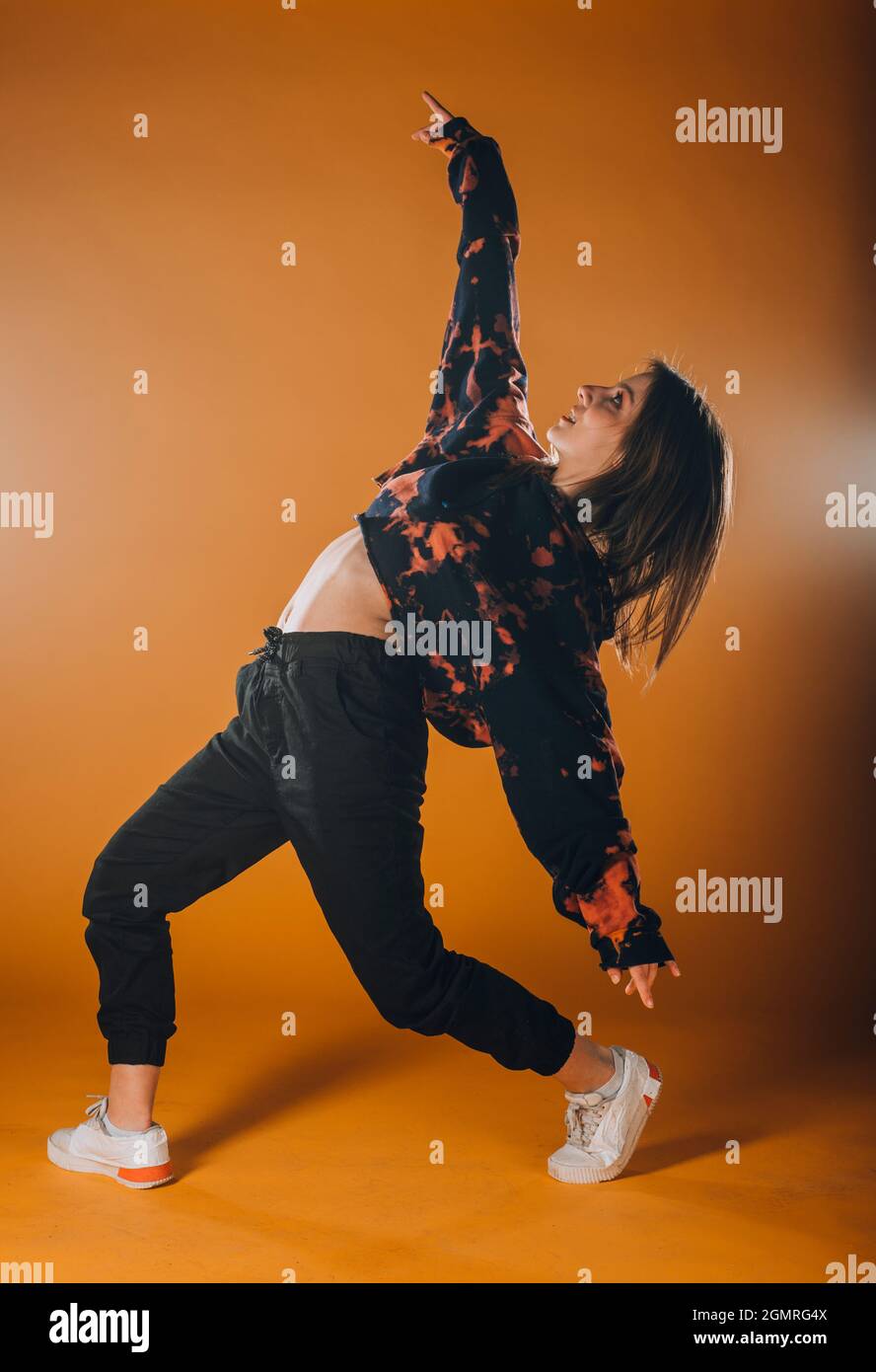 Artistic modern dancer practicing dancing moves in the studio Stock ...