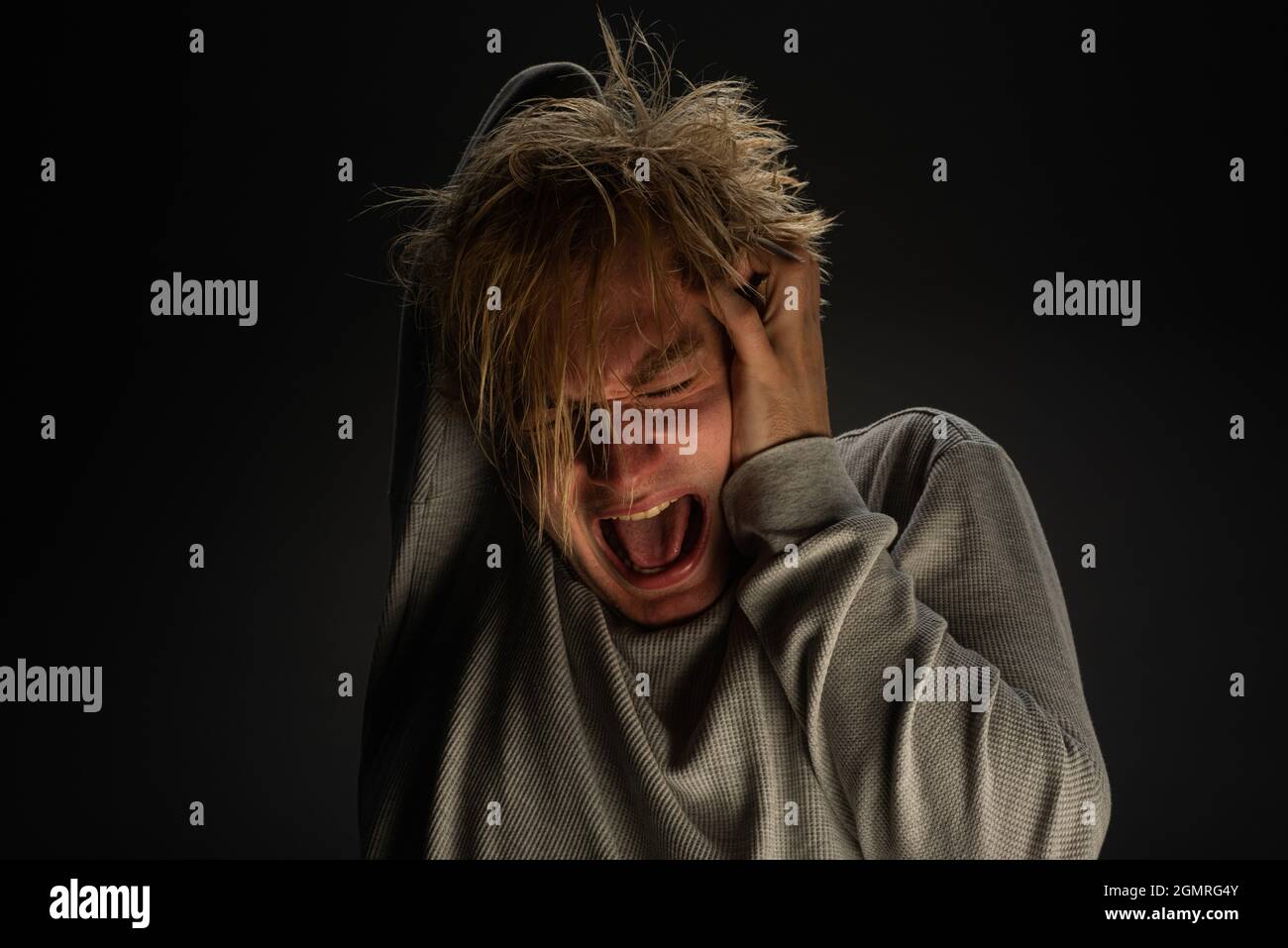 Broken boy is having so much pain in his scream while suffering so much ...