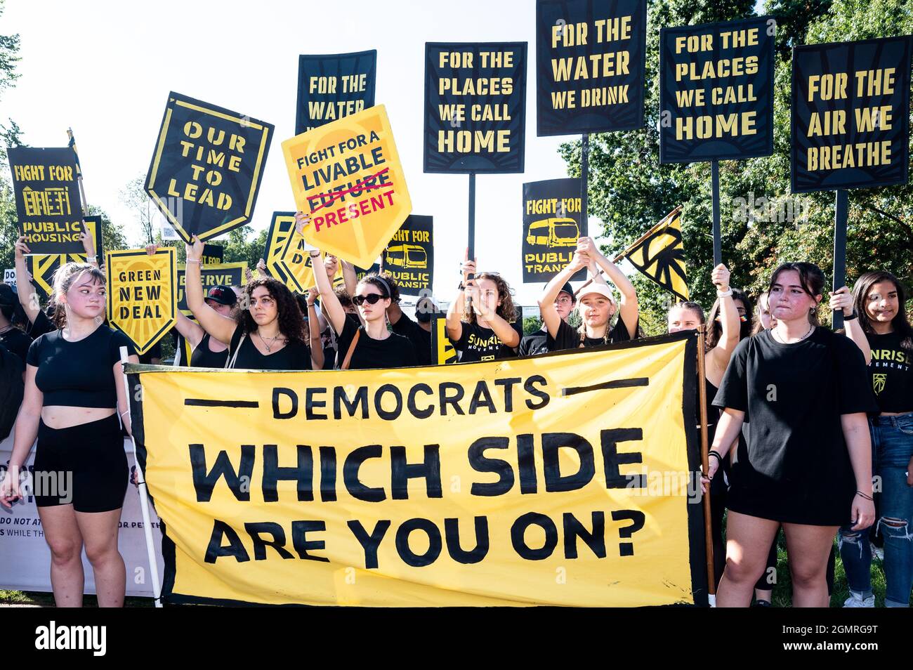Washington, United States. 20th Sep, 2021. Marchers hold placards and a ...