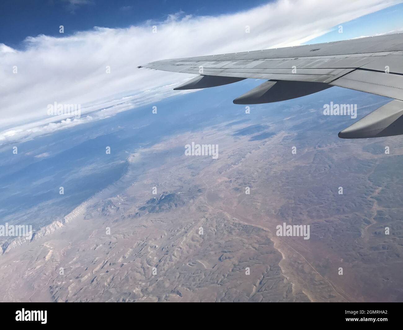 Window view of airplane wing of western United States ripple texture ...