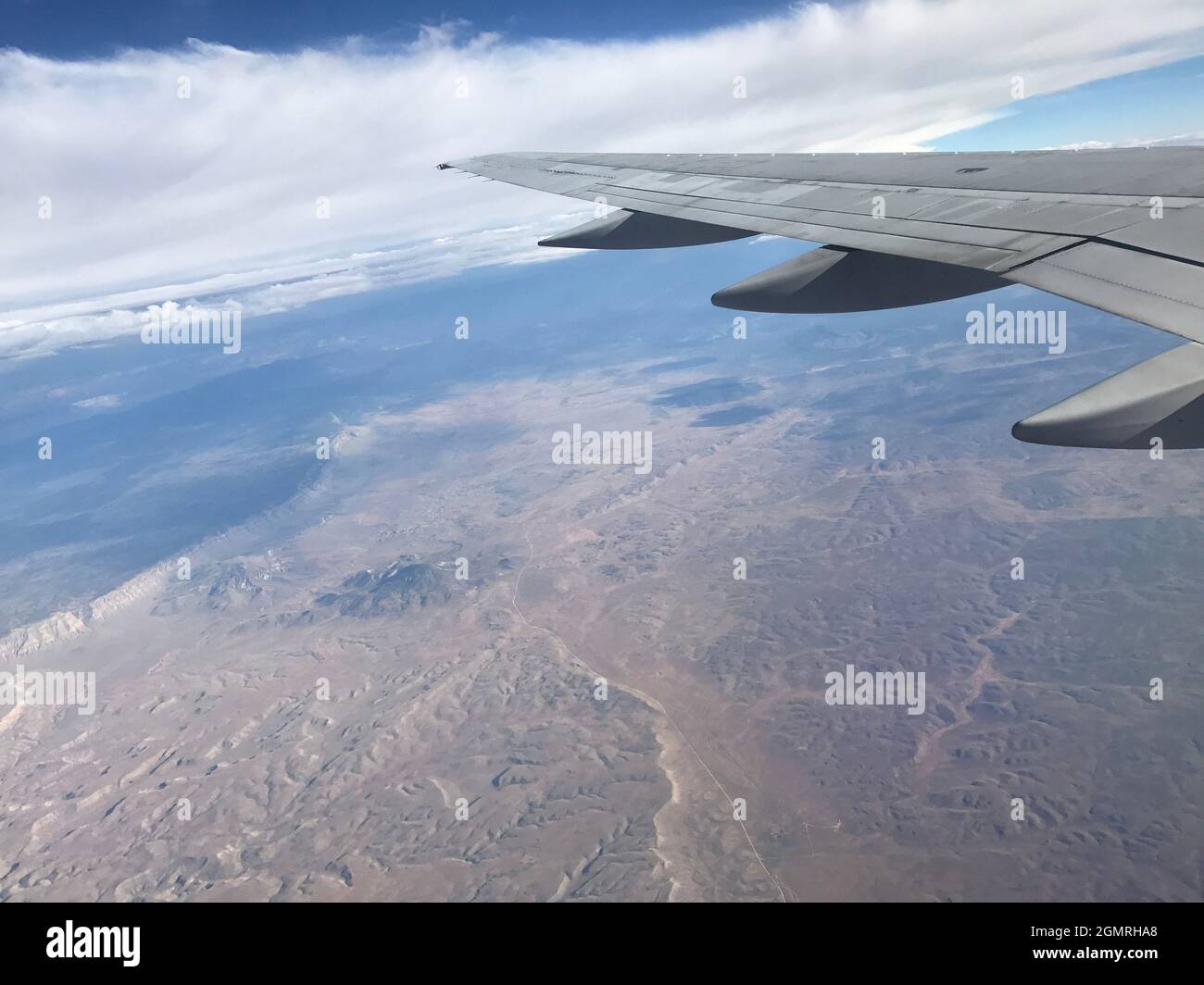 Window view of airplane wing of western United States ripple texture ...