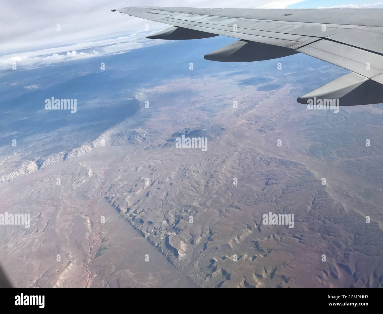Window view of airplane wing of western United States ripple texture ...