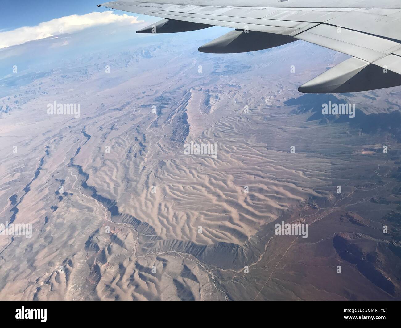 Window view of airplane wing of western United States ripple texture ...