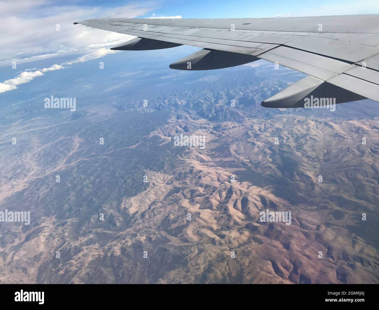 Window view of airplane wing of western United States ripple texture ...