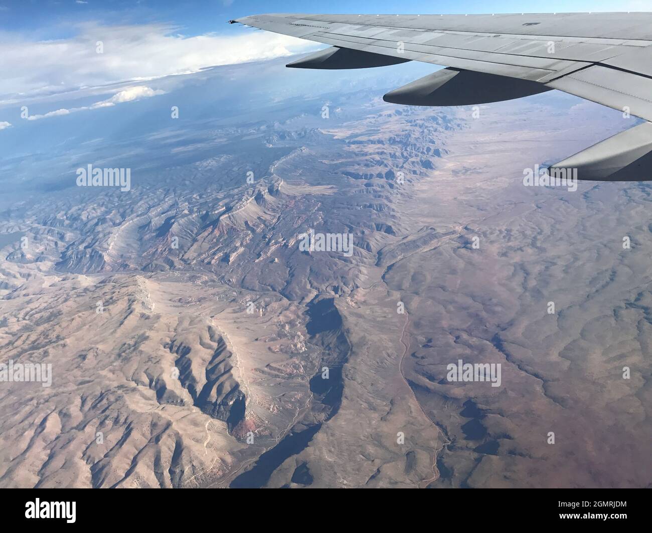 Window view of airplane wing of western United States ripple texture ...