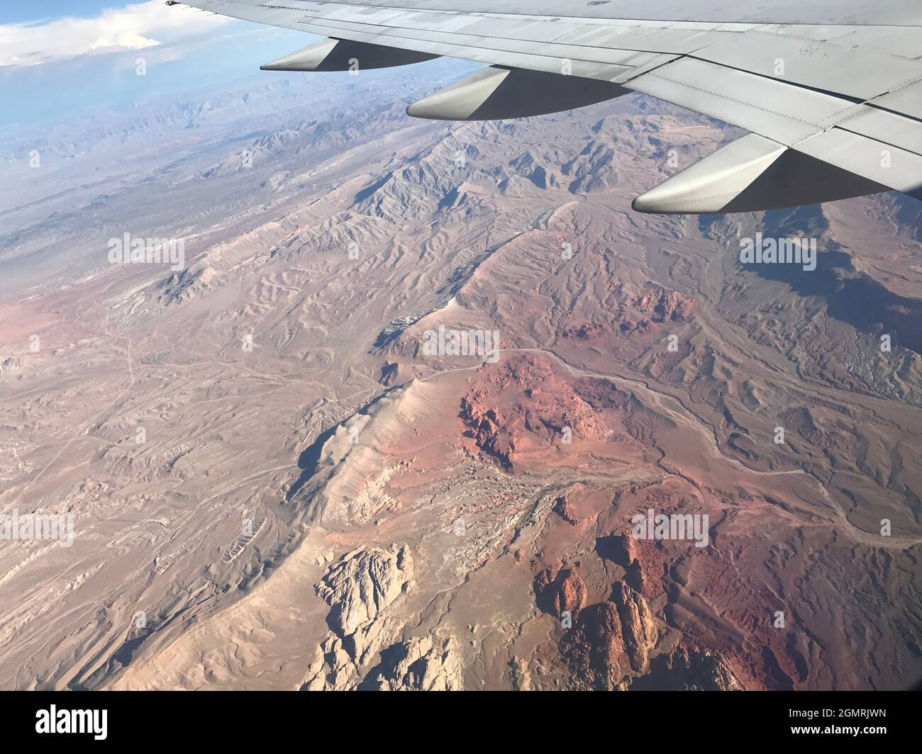 Window view of airplane wing of western United States ripple texture ...