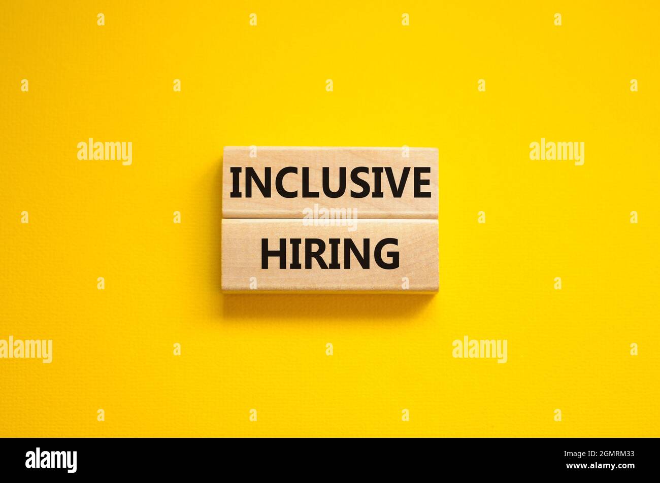 Inclusive hiring symbol. Wooden blocks with words Inclusive hiring on ...