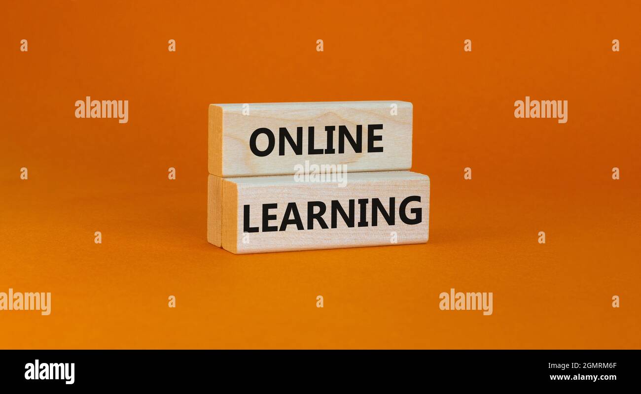 Online learning symbol. Concept words 'Online learning' on wooden ...