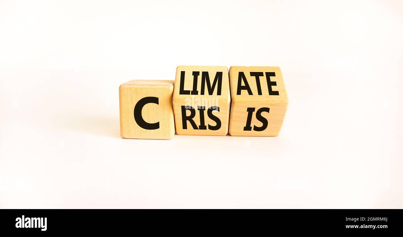 Climate crisis and change symbol. Turned wooden cubes with words ...