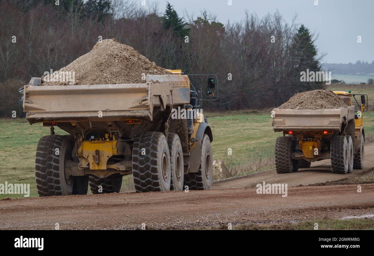 two yellow Volvo A40E articulated dump truck earth mover with 25 tonne ...