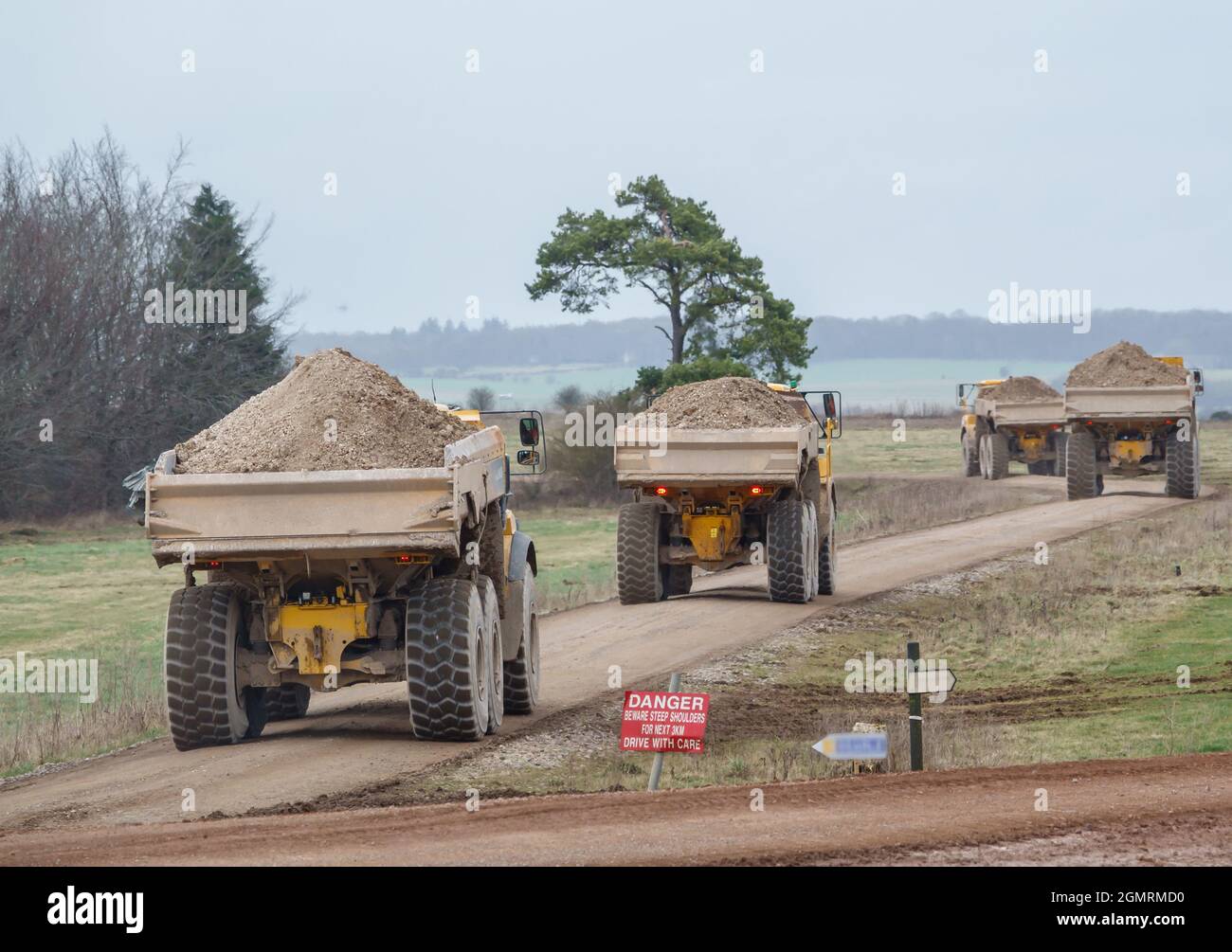 four yellow Volvo A40E articulated dump truck earth mover with 25 tonne ...