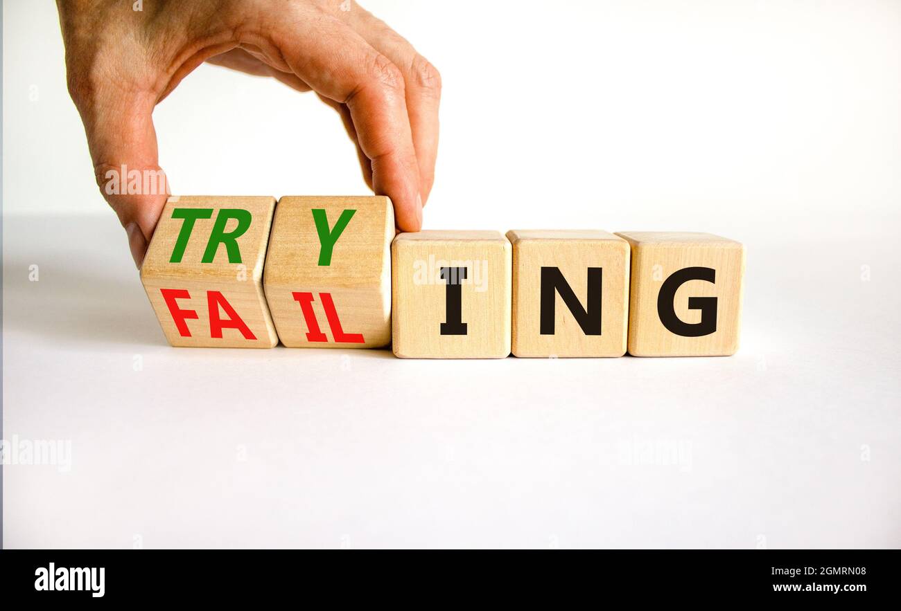 Failing or trying symbol. Businessman turns wooden cubes and changes ...