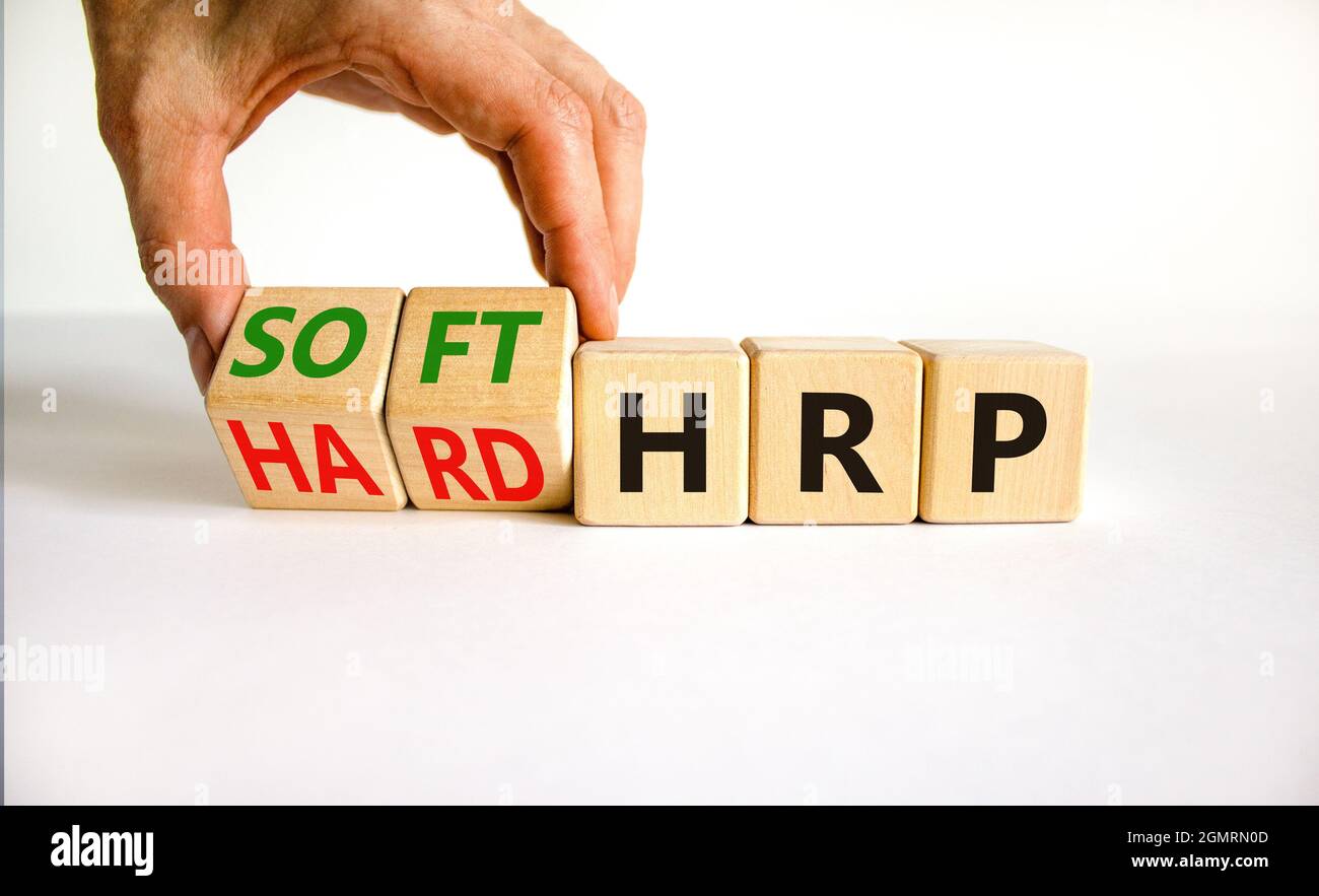 HRP, human resource planning symbol. Businessman turns wooden cubes and ...