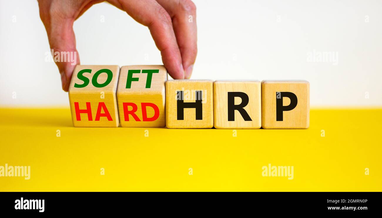 HRP, human resource planning symbol. Businessman turns wooden cubes and ...