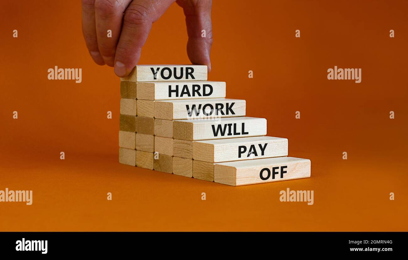 Concept of building success foundation. Businessman hand put wooden ...