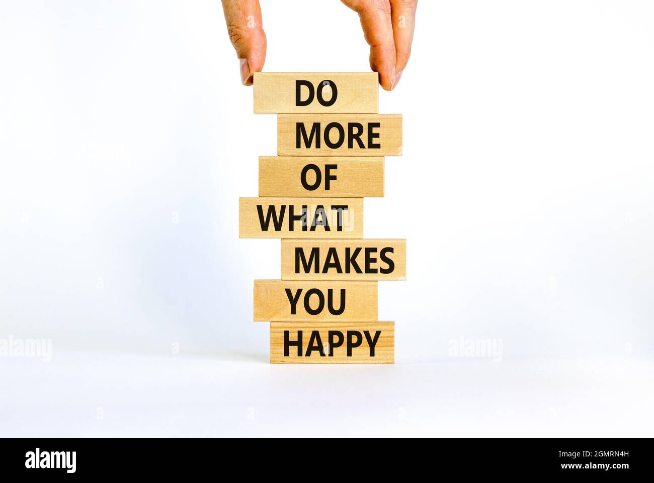 Do what makes you happy symbol. Wooden blocks with words 'Do more of ...
