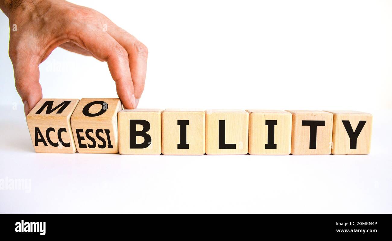 Mobility and accessibility symbol. Businessman turns wooden cubes and ...